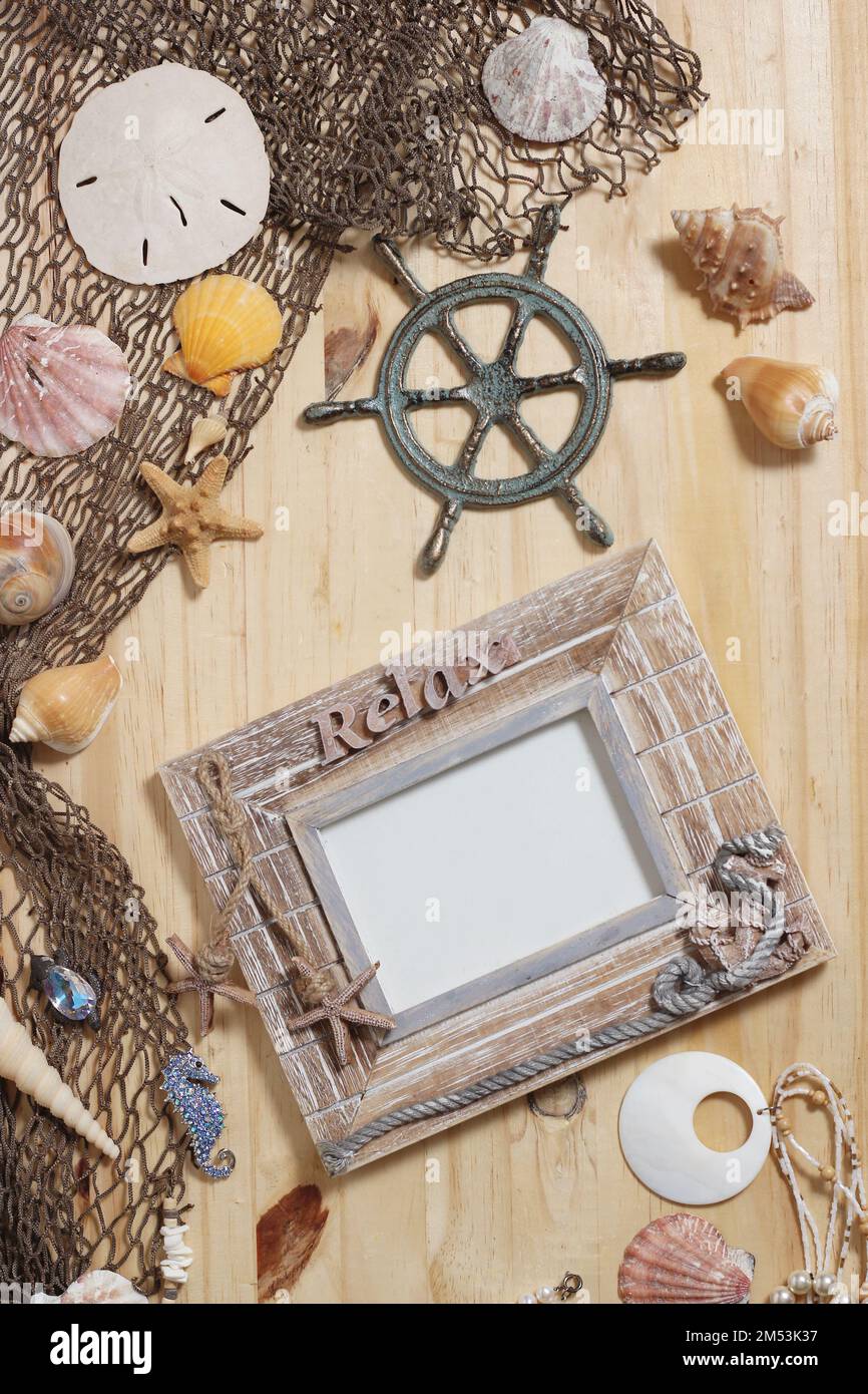 An Empty Frame on Wood Background With Sea Shells and Fishing Net ...