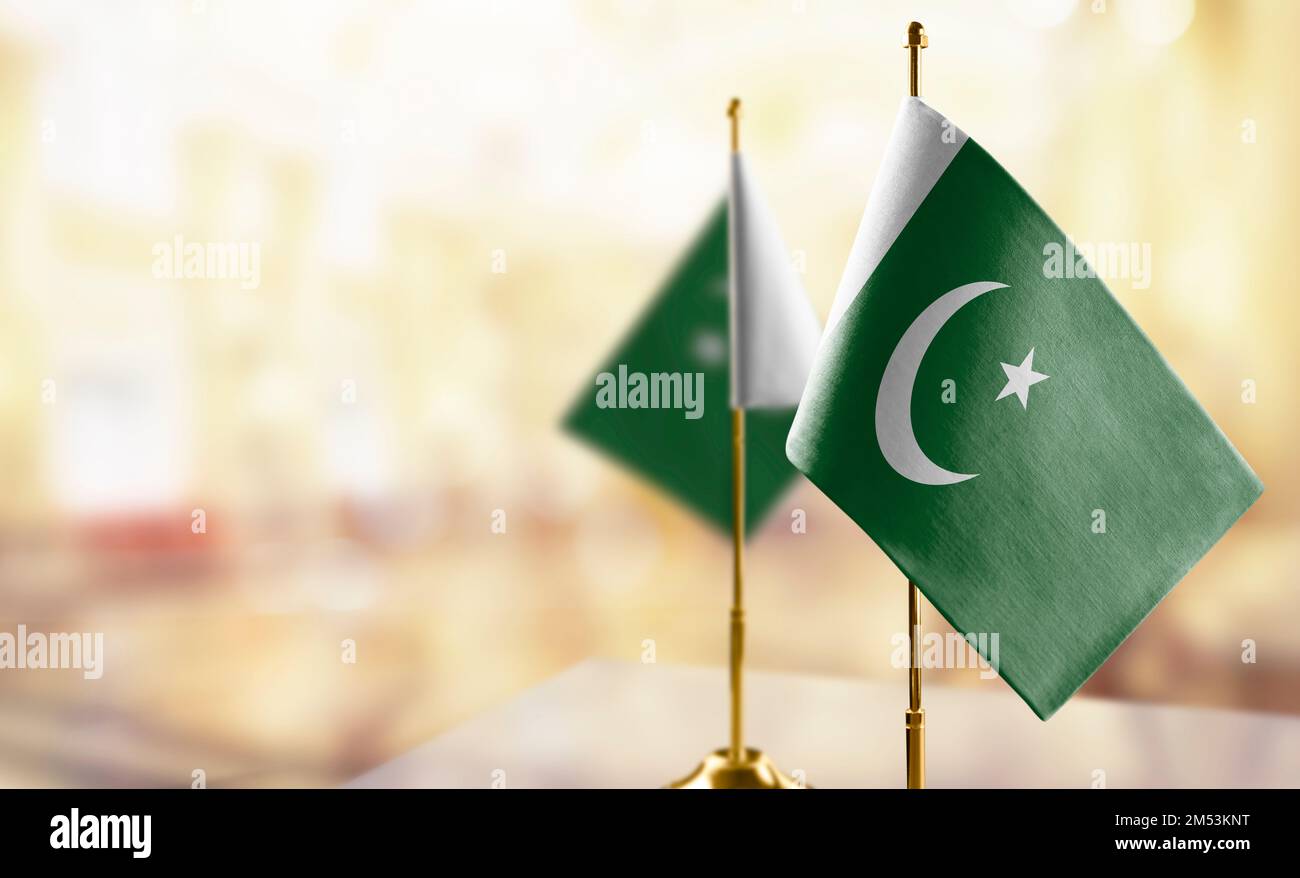 Small flags of the Pakistan on an abstract blurry background Stock ...