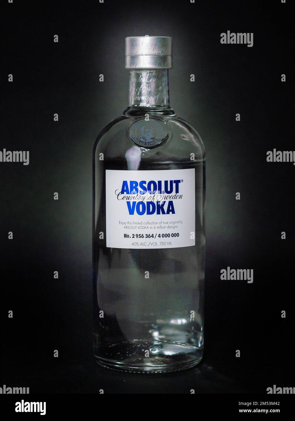 A vertical shot of a Limited edition Absolut Vodka bottle placed in ...