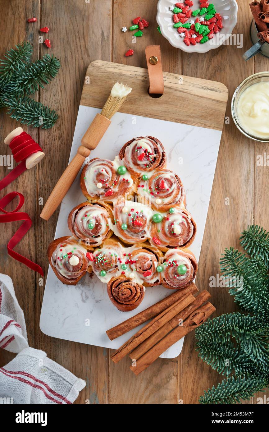 Christmas tree shape cinnamon rolls or cinnabon buns with cinnamon and ...