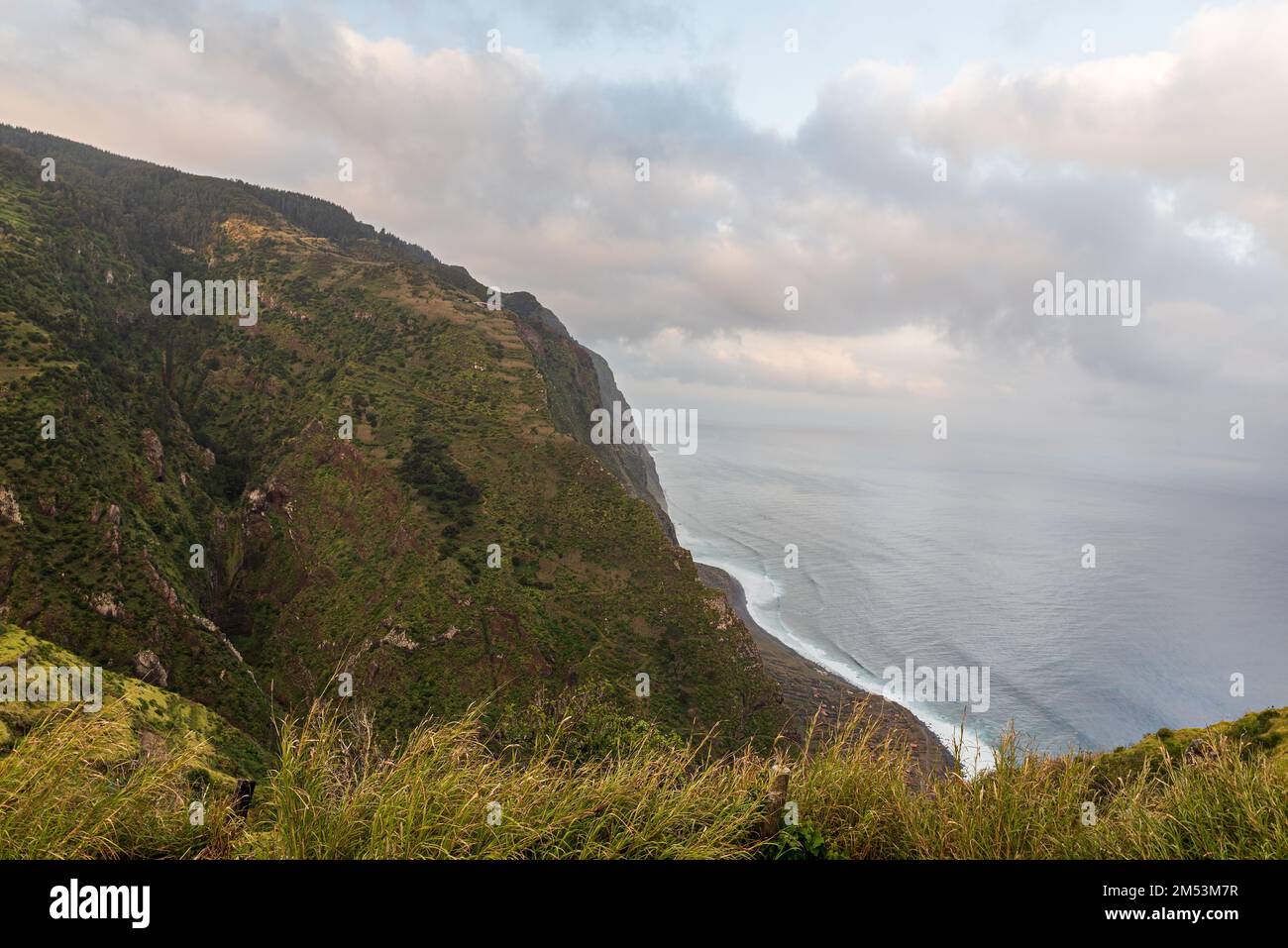 Atlantic ocean with beach and steep hills above in northwest part of ...