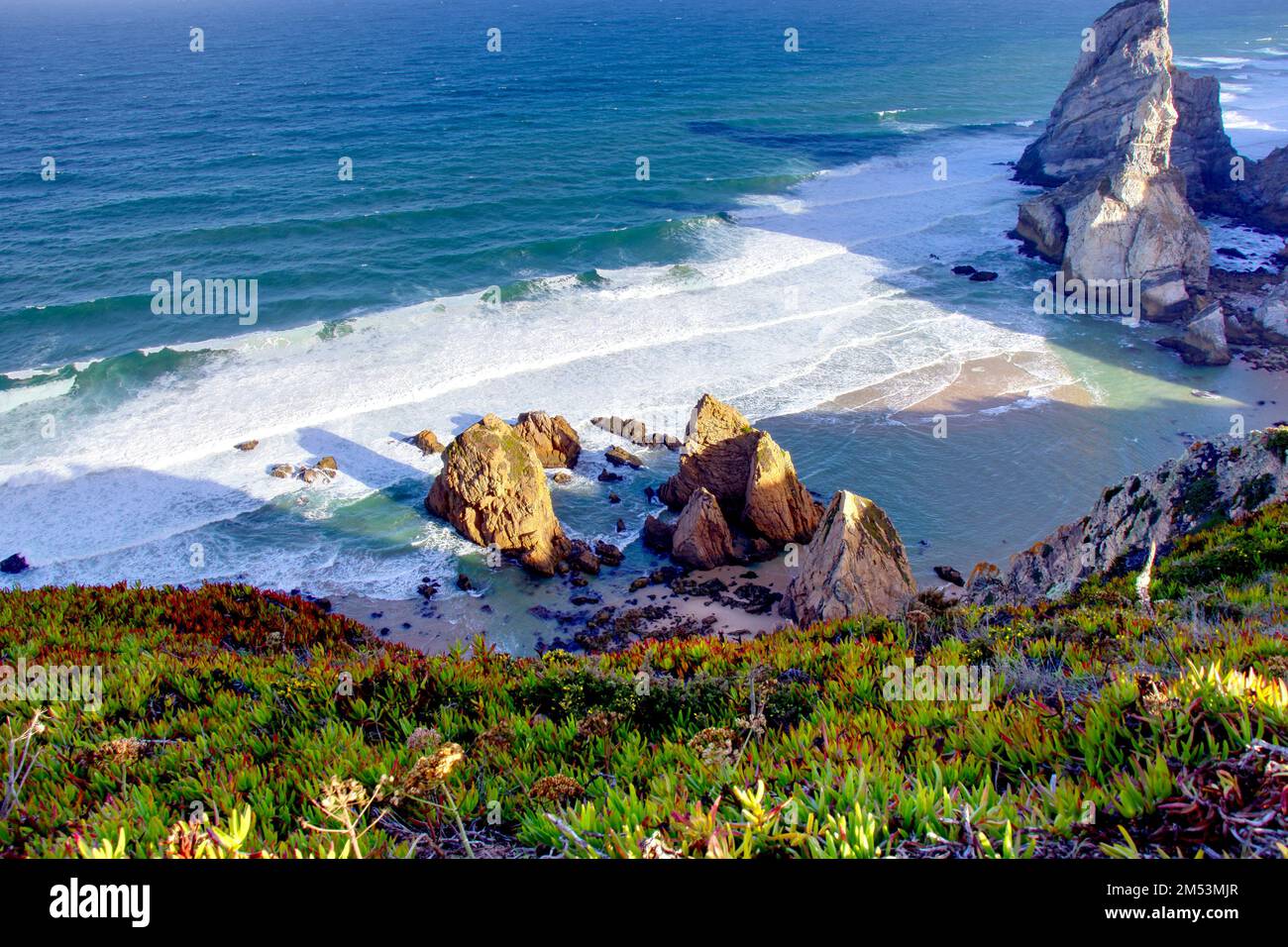 A top view of a scenic coastal scenery in Portugal with rock formations ...