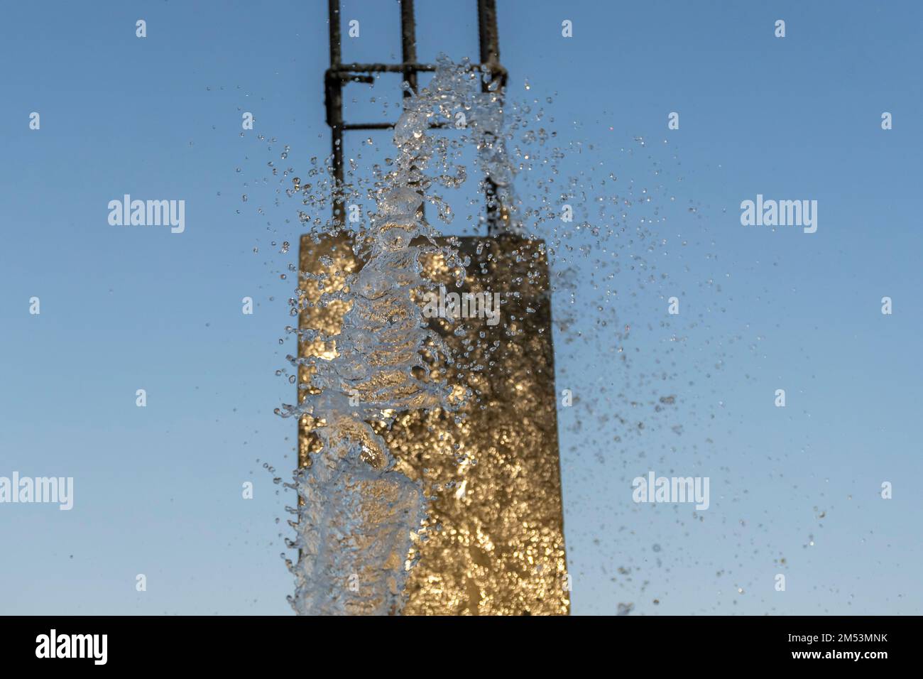 Construction labour curing brick cement column by using plastic pipe to ...