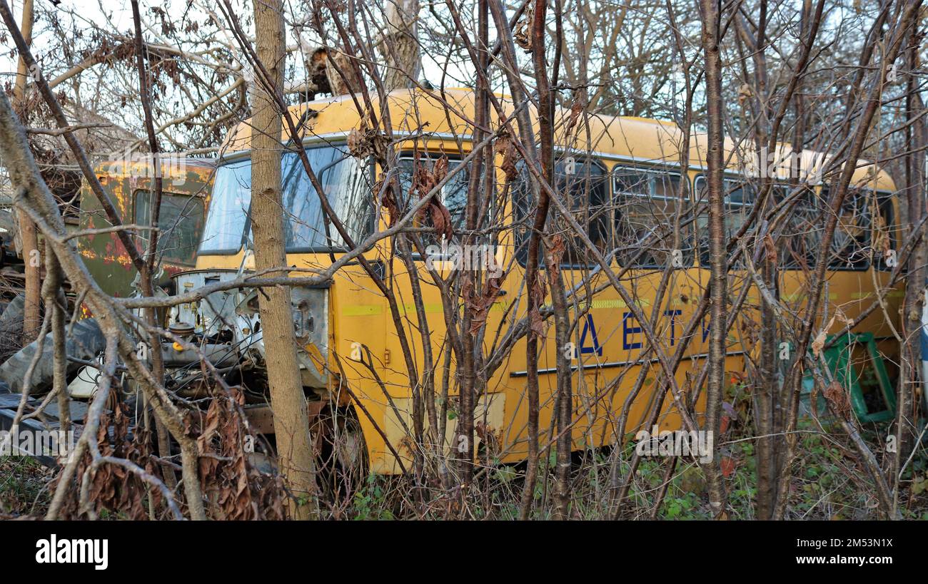 Yellow school bus with the inscription in Russian "Children" abandoned ...