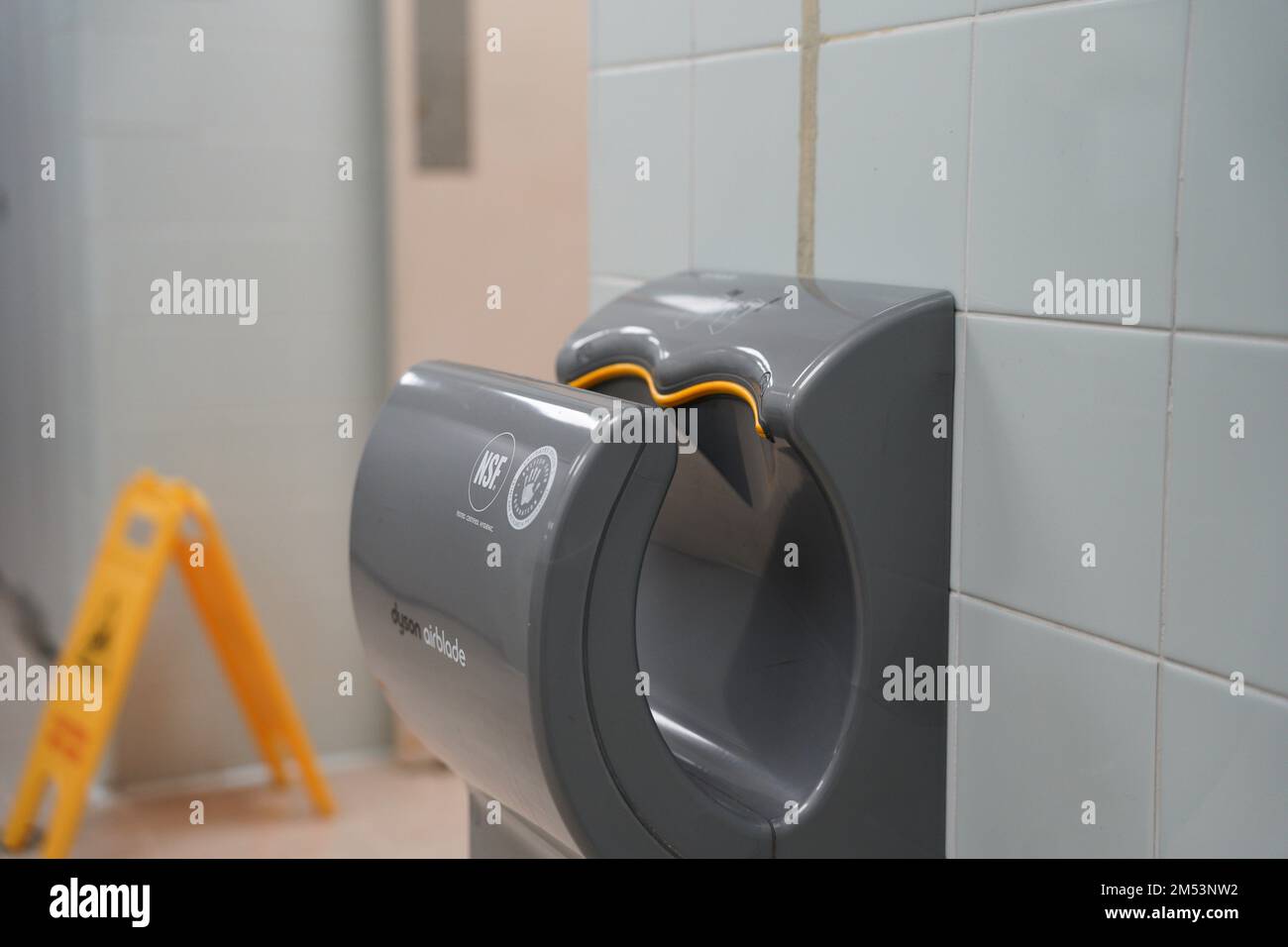 Hand Airdry The Electric Towel. On the blue ceramic wall with a slippy ...