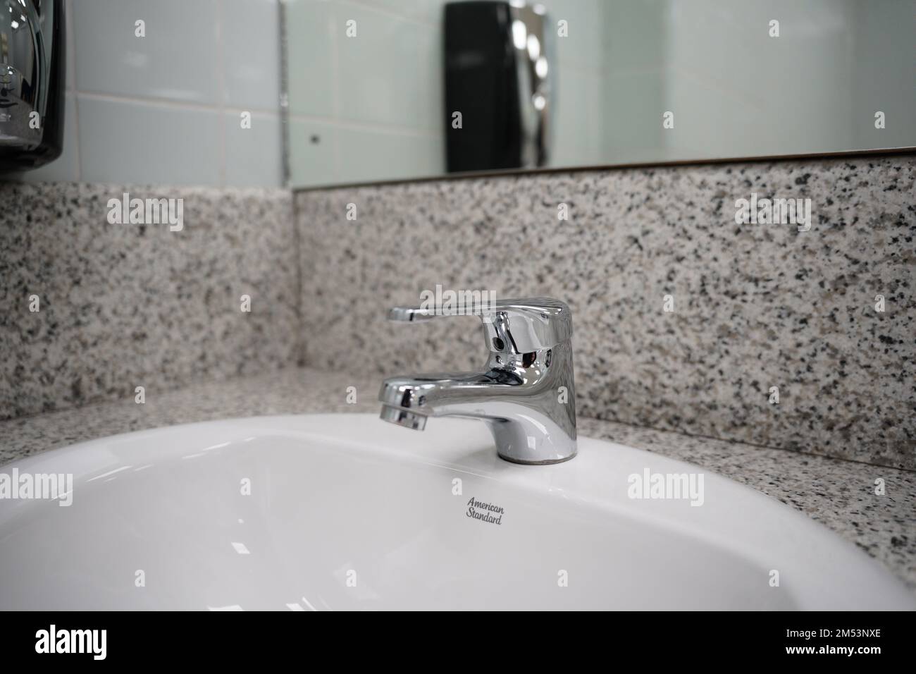 Modern bathroom chrome faucet with running water,Modern faucet with ...
