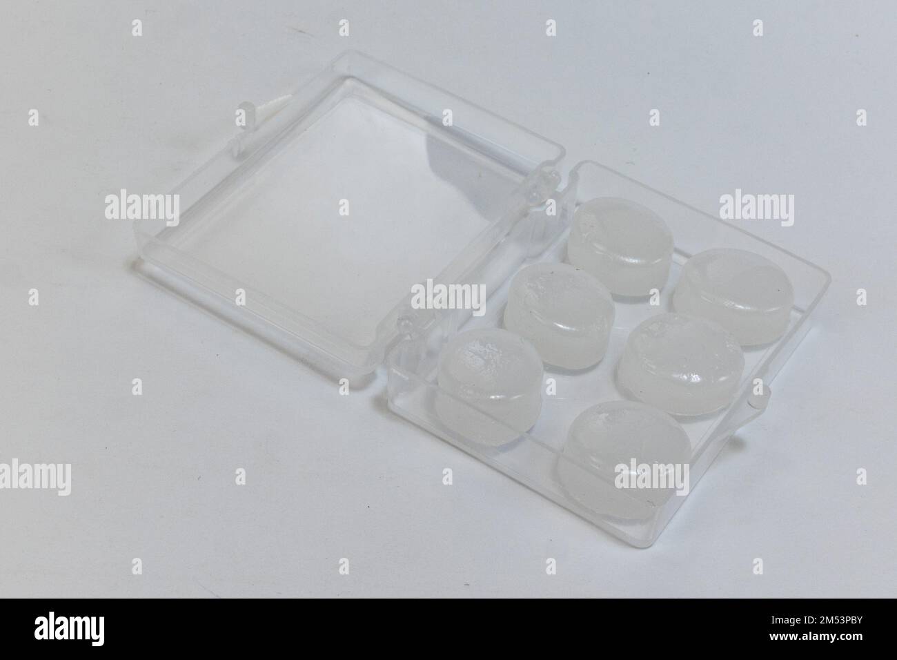 Silicone ear plugs for human ears on white background Stock Photo - Alamy