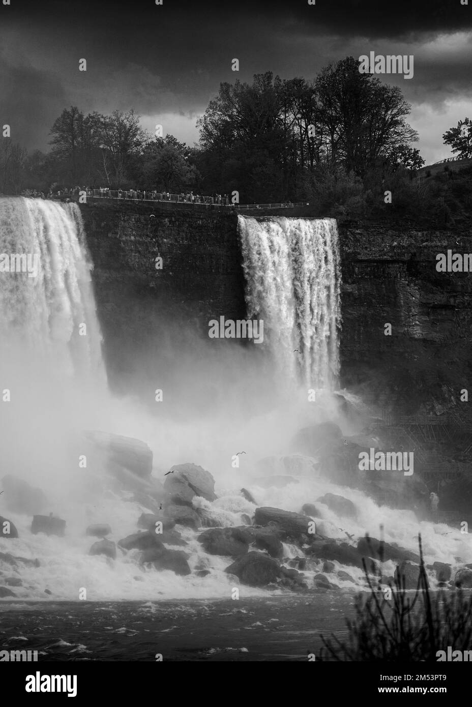 Rocky waterfall flowing down steep Black and White Stock Photos ...