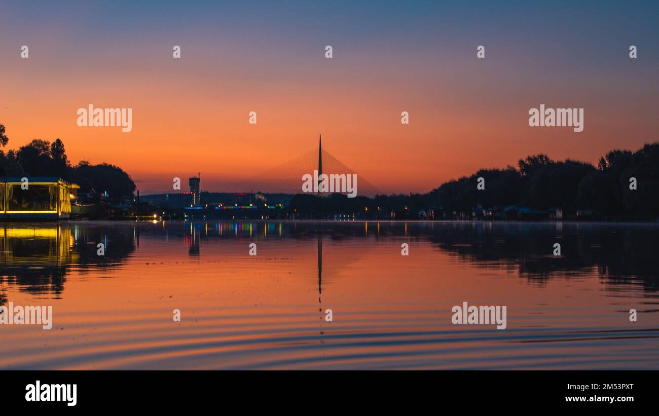 A beautiful sunset over Ada Lake and bridge in Belgrade, Serbia Stock ...