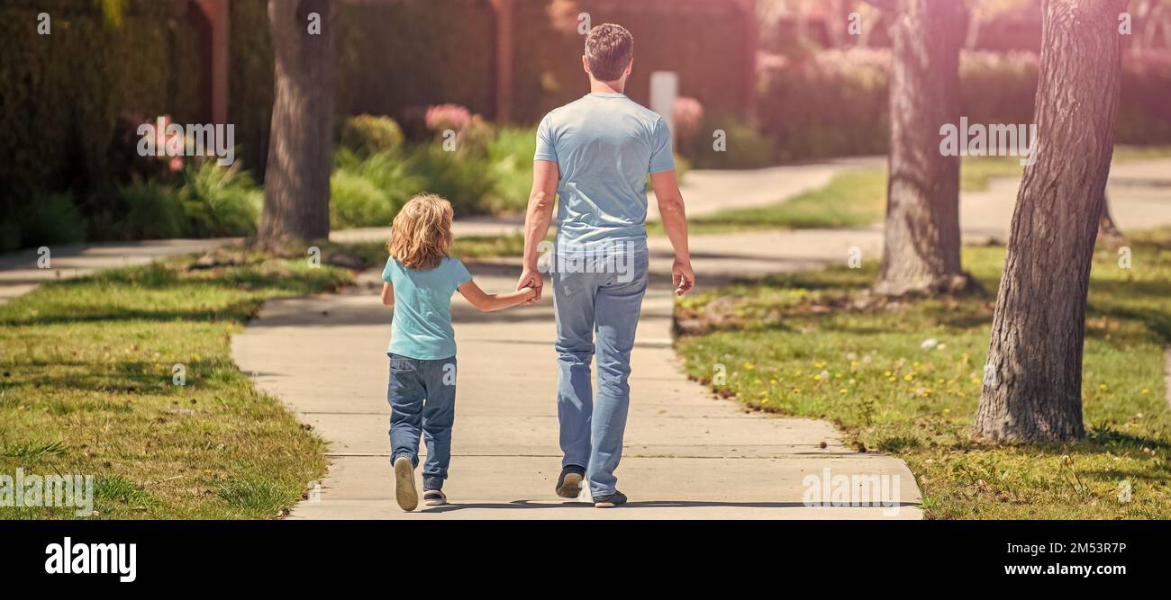 Banner of father and son walk in park back view. family value ...