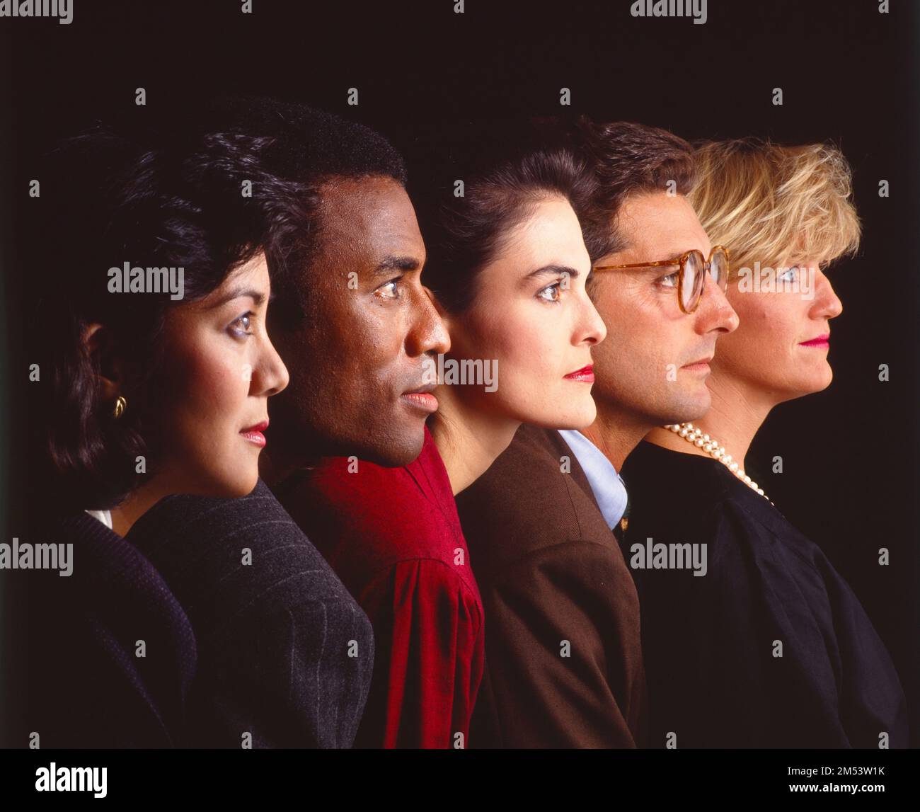 Staggered row of business people standing All looking out same ...