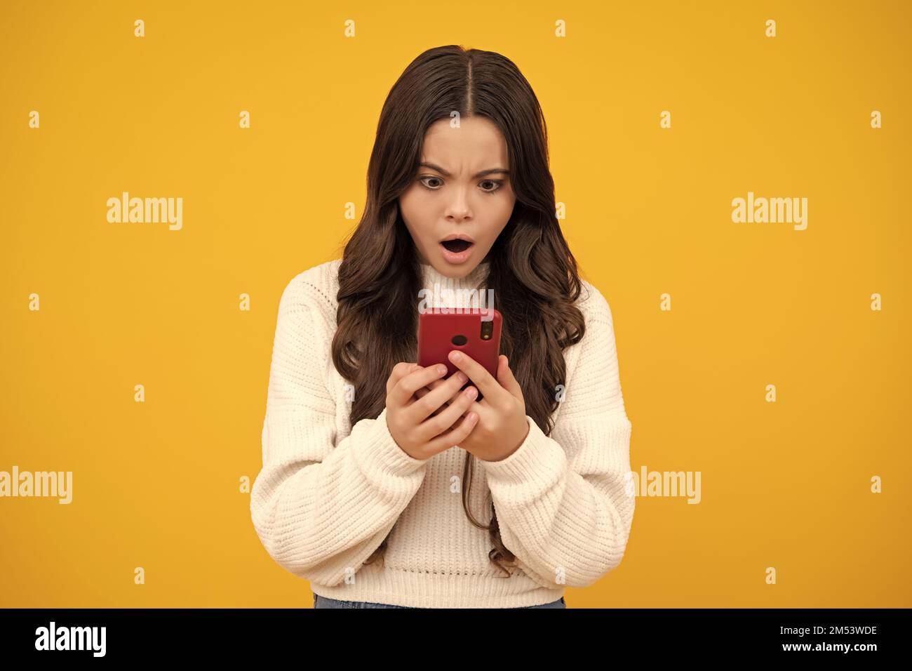 Mobile online shopping. Cute teen child girl paying with phone, texting ...