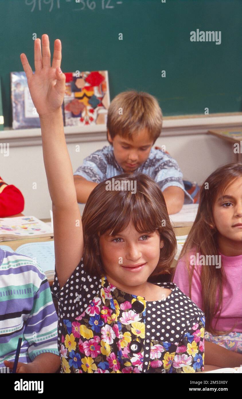 Child raising hand classroom hi-res stock photography and images - Alamy