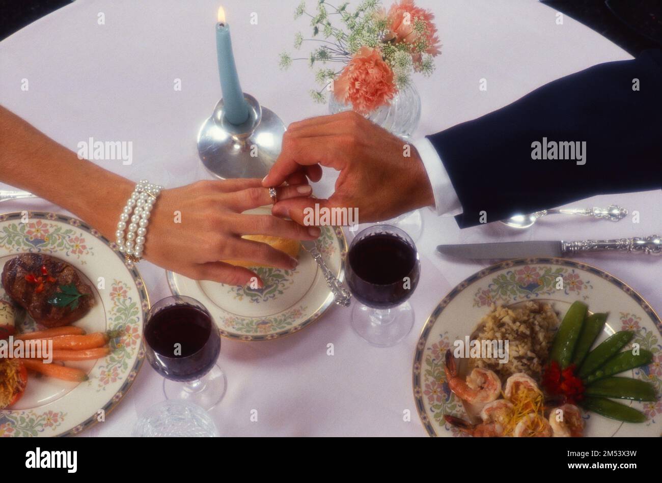 Putting engagement ring on hi-res stock photography and images - Alamy
