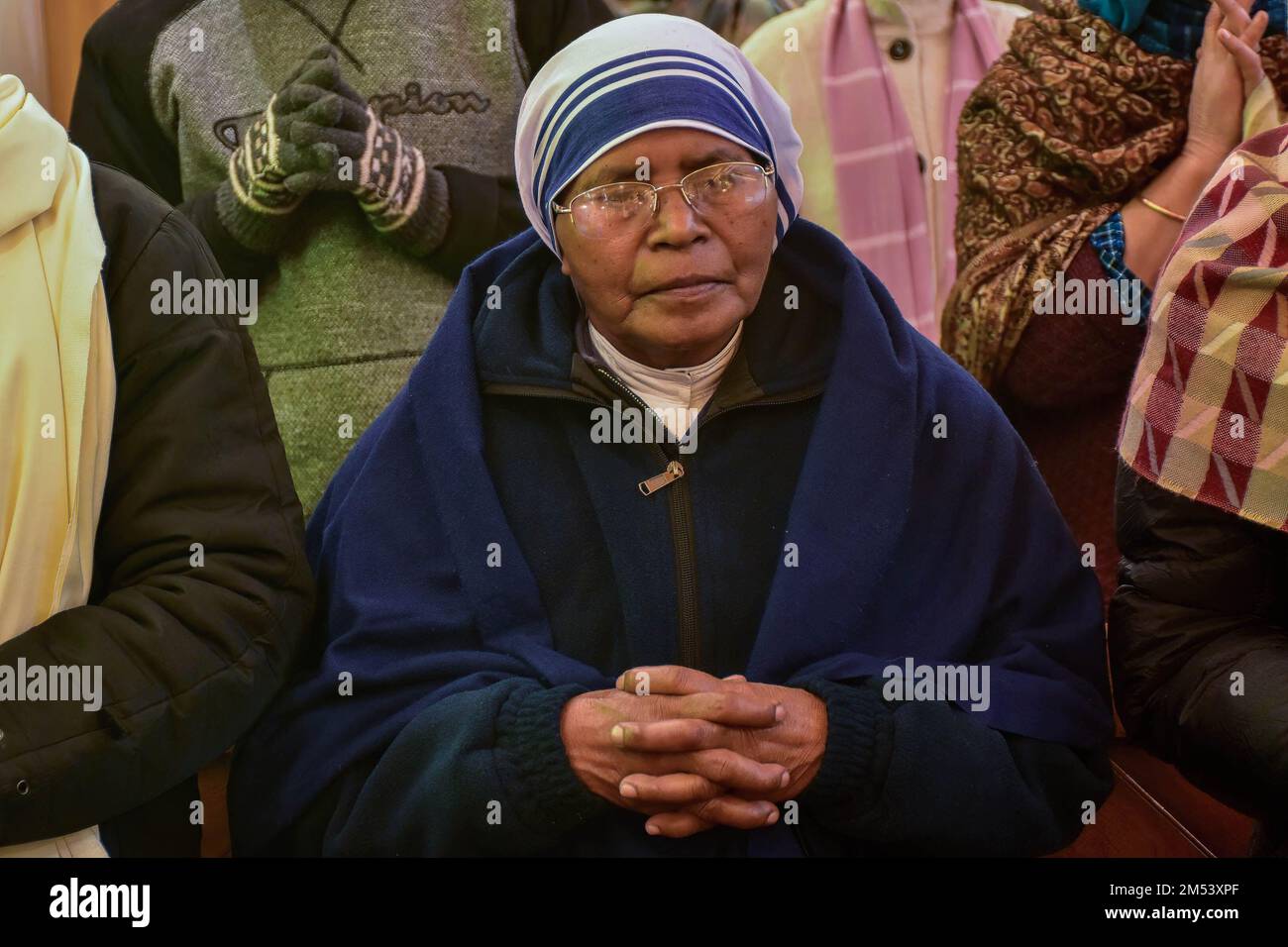 Srinagar, India. 25th Dec, 2022. A Christian devotee prays inside the ...