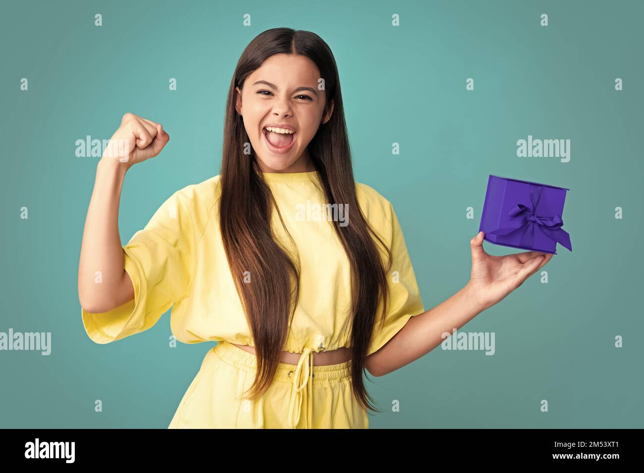 Teenage kid with present box. Teen girl giving birthday gift. Present ...