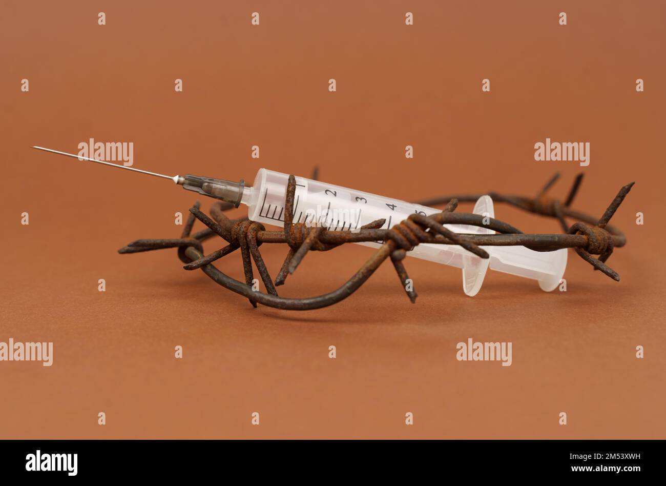 The concept of justice and law. On the brown surface is a drug syringe ...