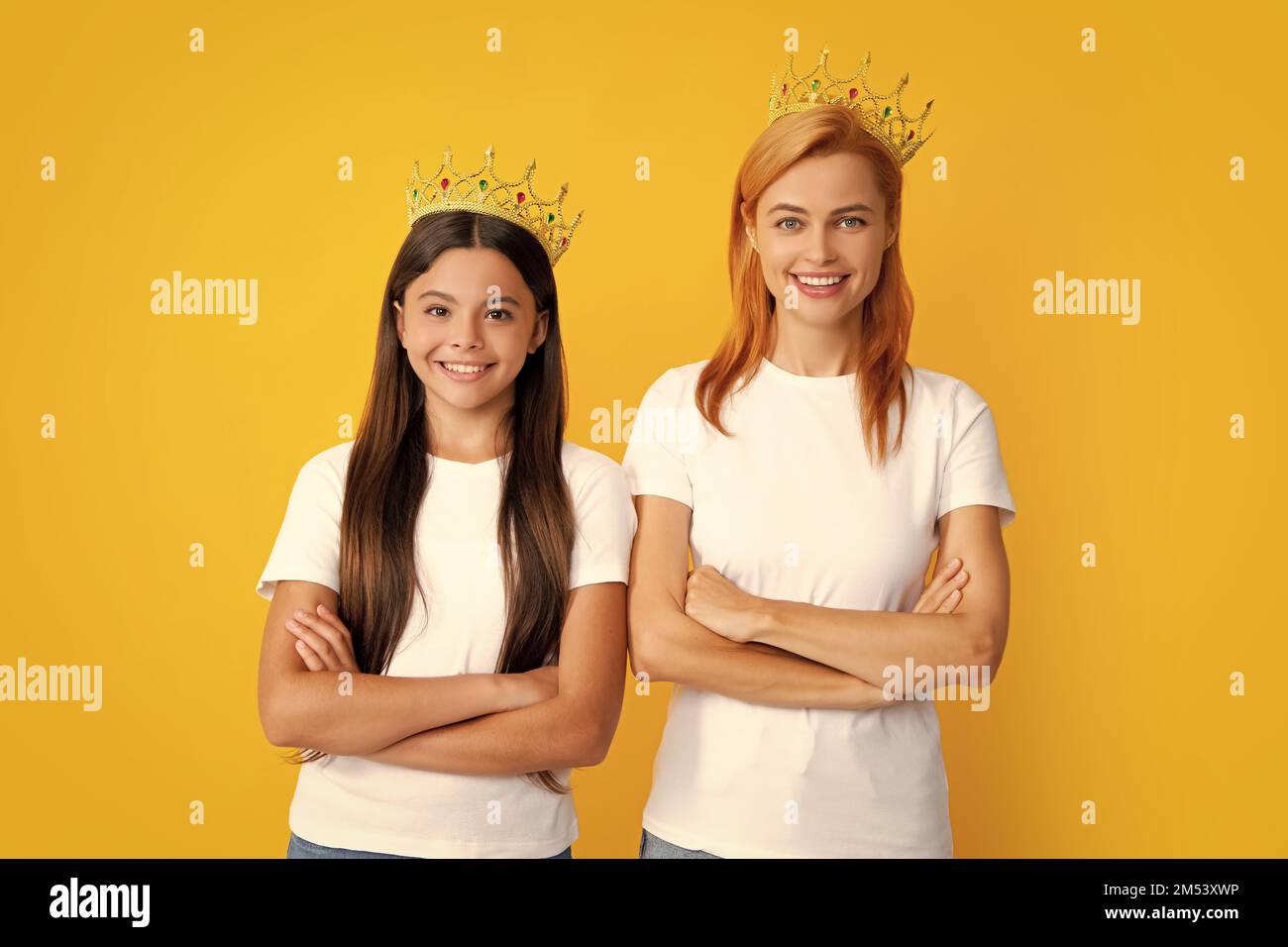 Happy woman mother and daughter child wearing crowns. Happy loving ...