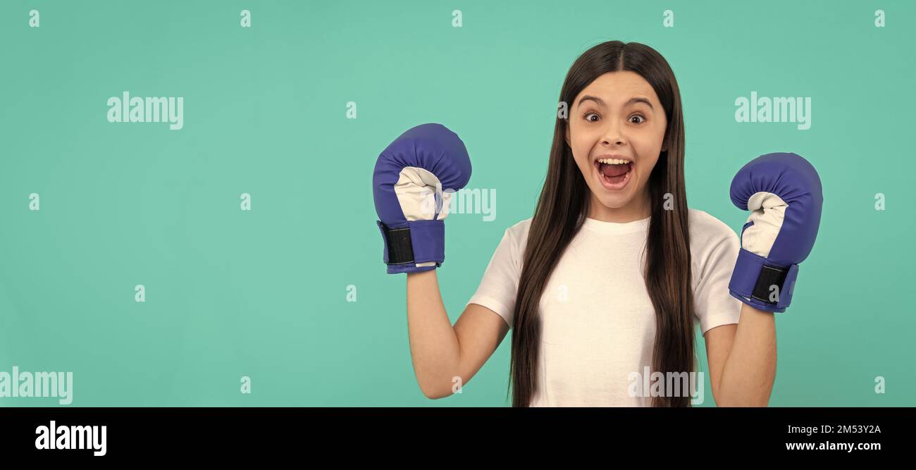 happy child boxer celebrate success in boxing gloves during sport ...