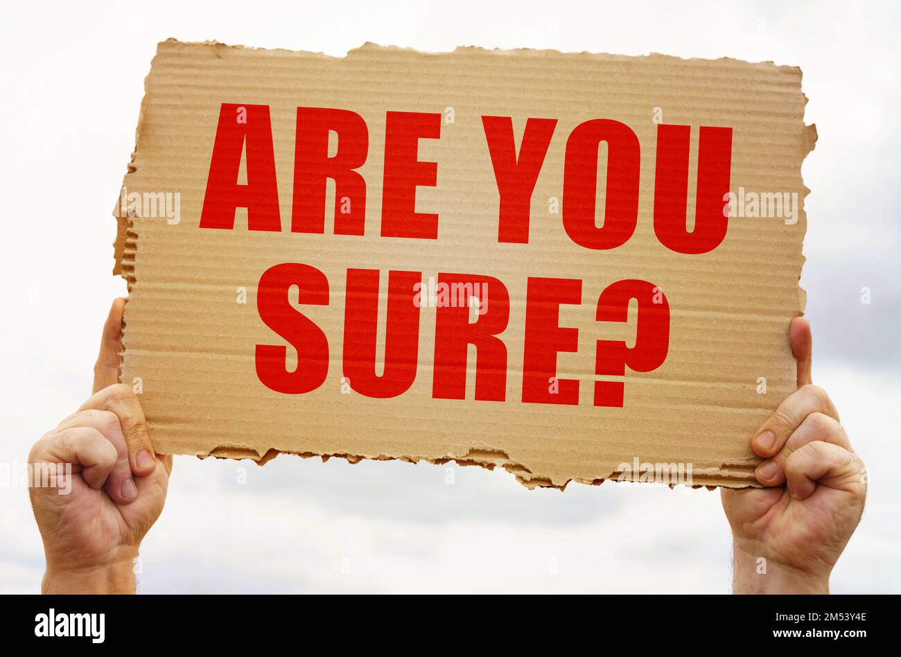 Business concept. In the hands of a man is a cardboard sign with the ...