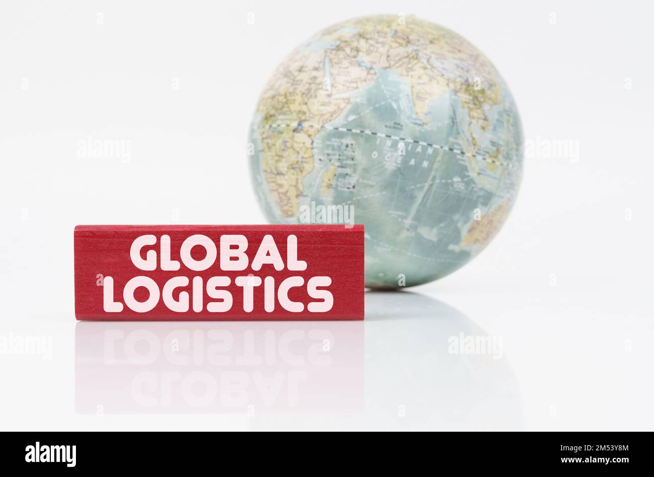 business and transport concept. Near the globe is a red plaque with the ...