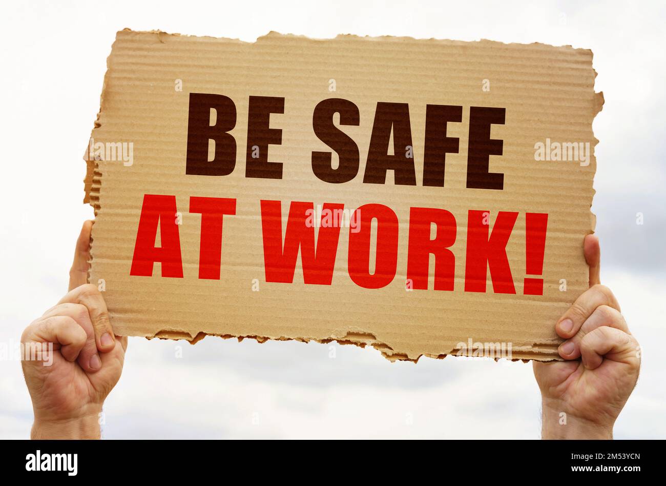 Business concept. In the hands of a man is a cardboard sign with the ...