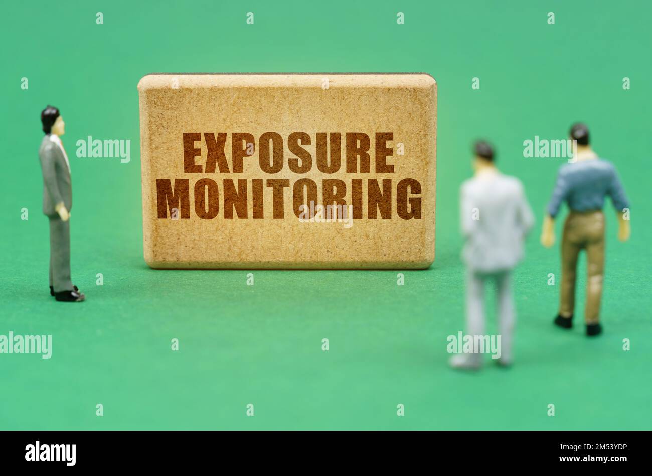 Security and insurance concept. On the green surface are figures of ...