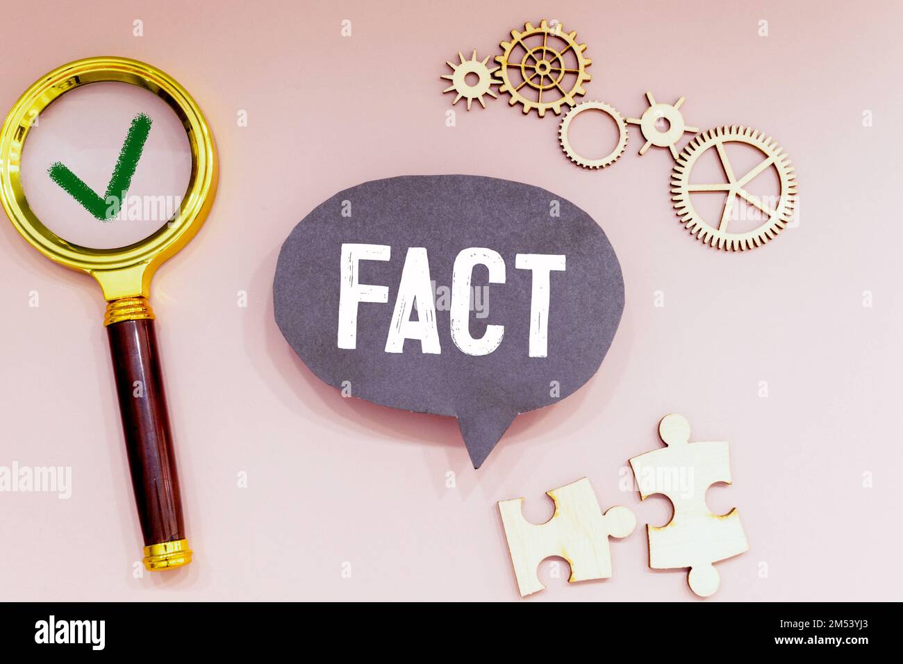 Fact - Word Through Magnifying Glass on yellow table Stock Photo - Alamy