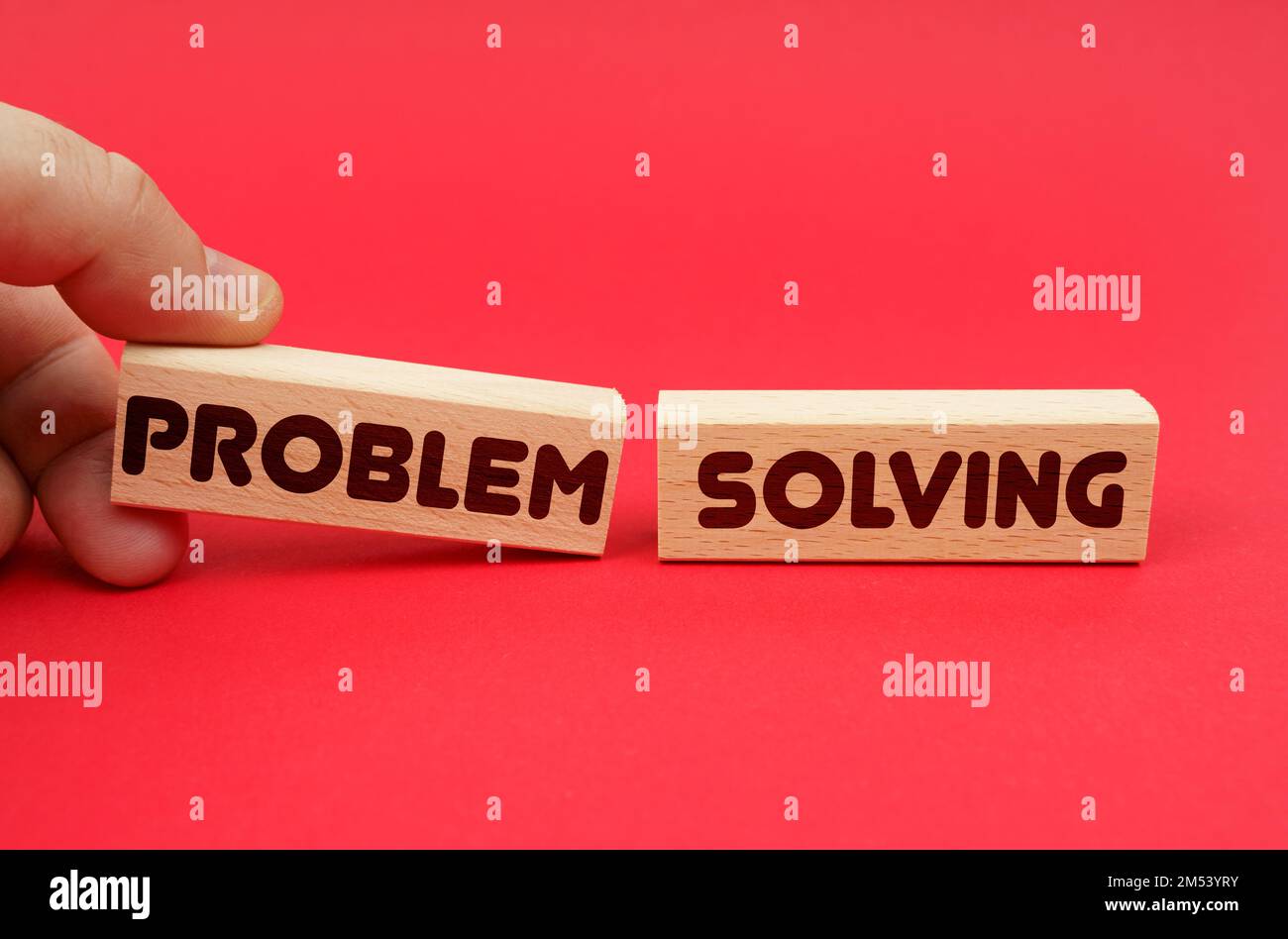 Business concept. On a red background, wooden blocks, one of them in ...