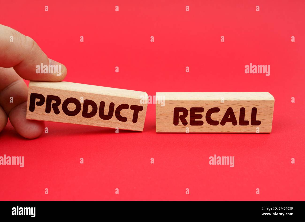 Business concept. On a red background, wooden blocks, one of them in ...