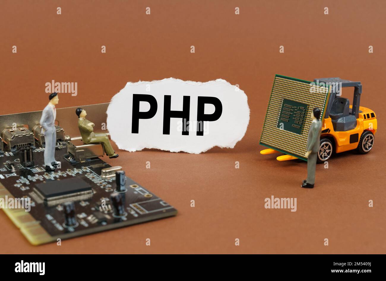 Technology and business concept. On a brown surface, a loader with a ...