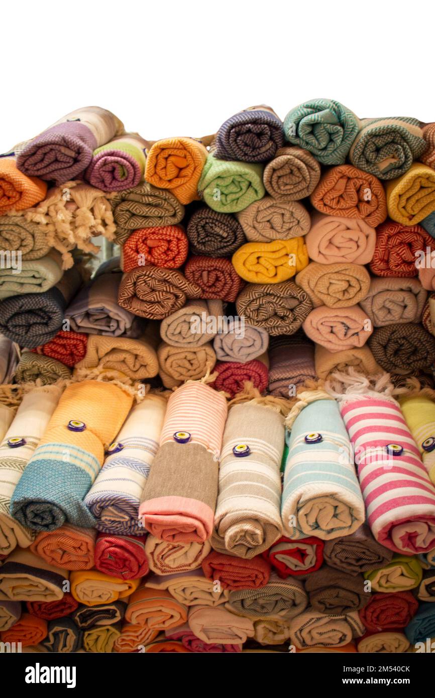 Sale of textiles and fabric on white background on the Turkish market ...