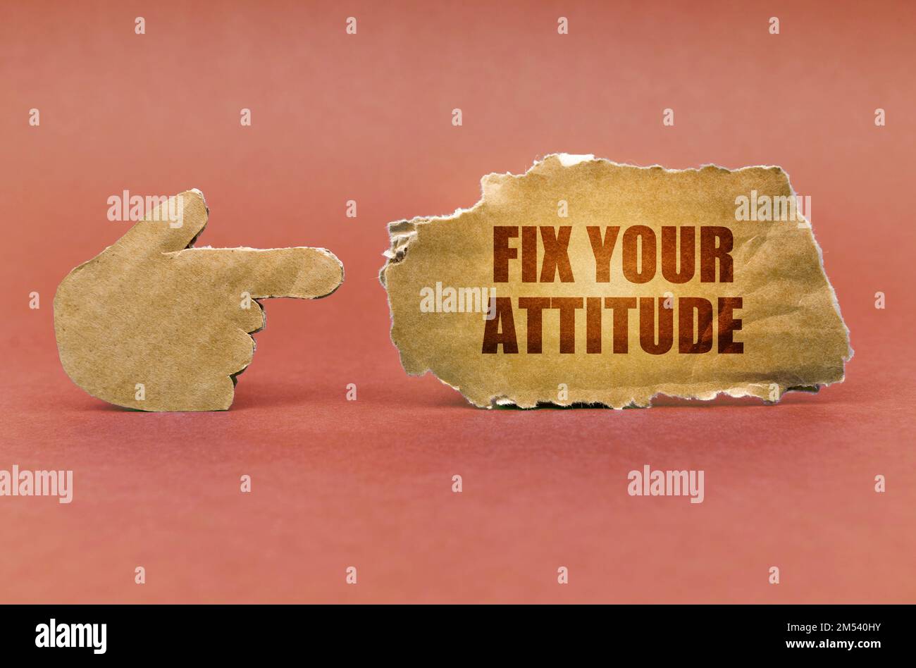 Business and technology concept. On a brown surface, a cardboard hand ...