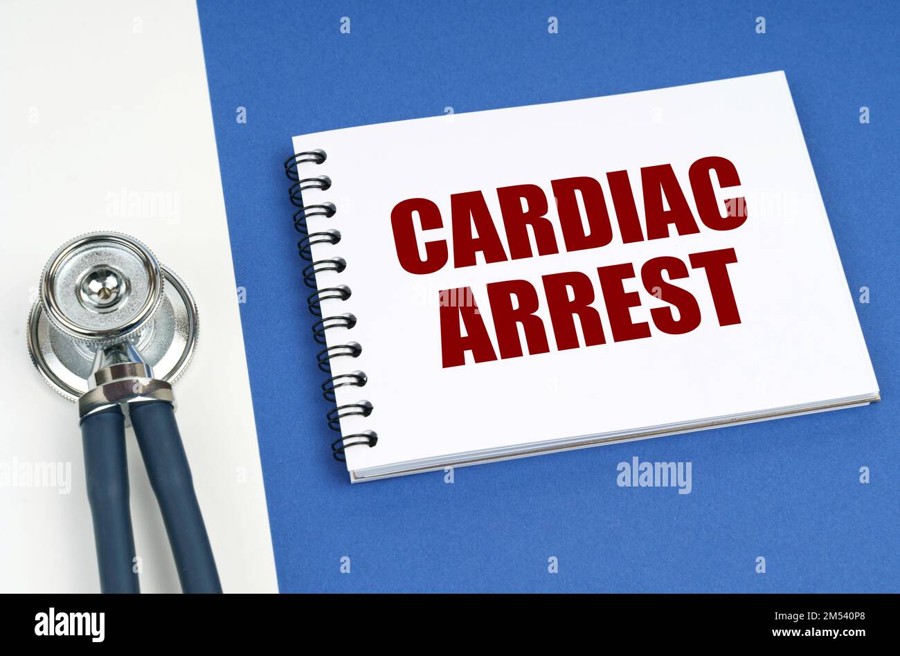 Medical concept. On a blue-white surface lies a stethoscope and a ...