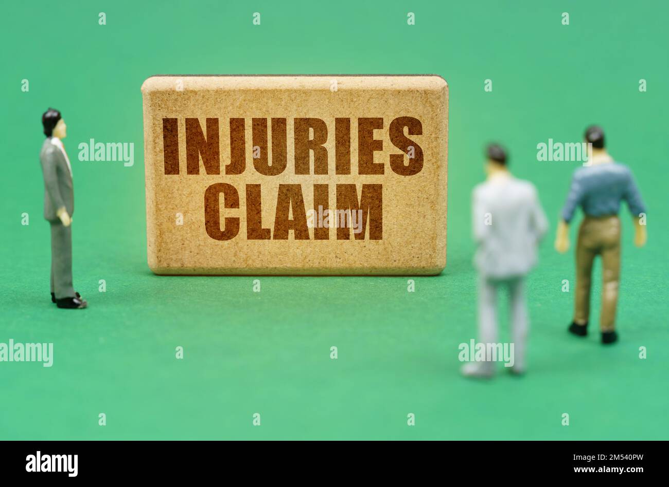 Security and insurance concept. On the green surface are figures of ...