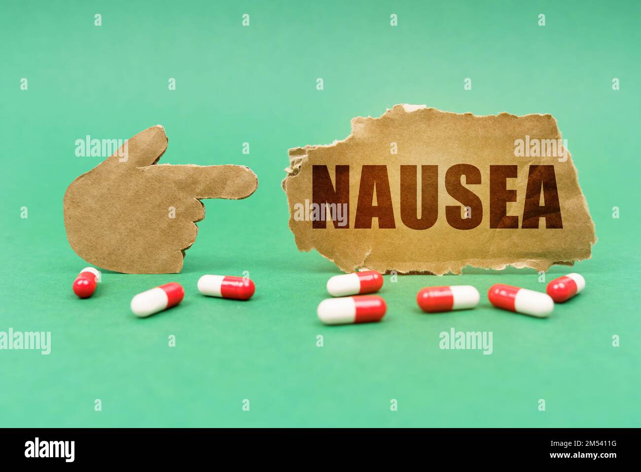 Medical concept. On the green surface of the tablet and a hand pointing ...