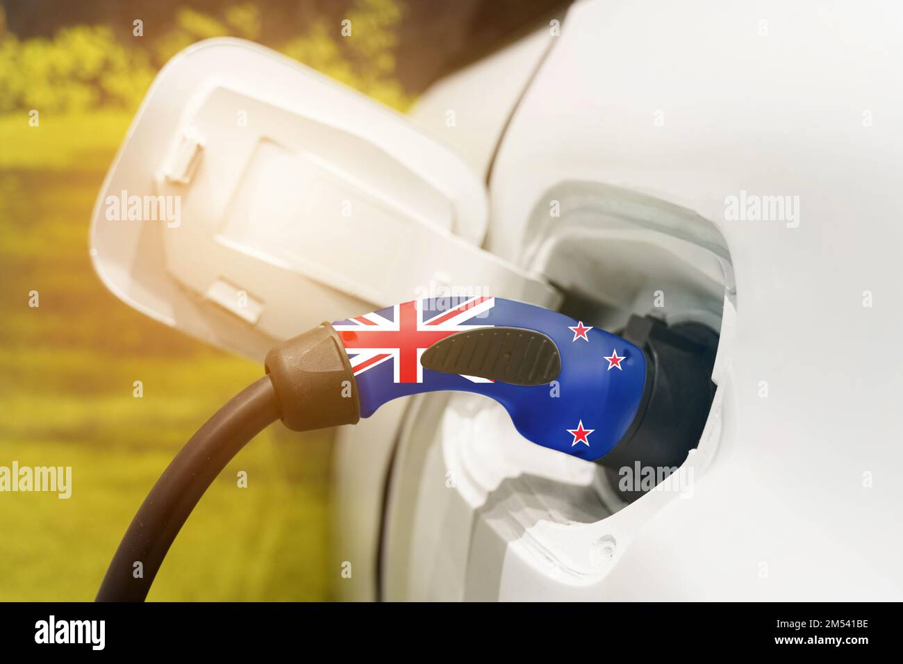 The concept of ecological transport. Charging an electric vehicle with ...