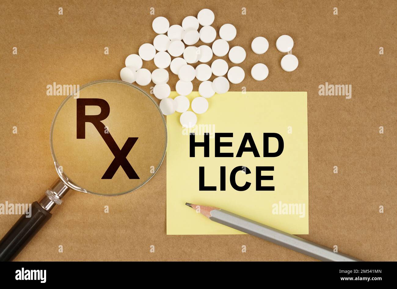 Medical concept. On the table are pills, a magnifying glass, pencils ...