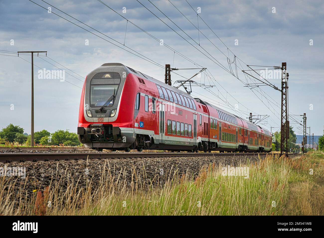 A beautiful view of a modern locomotive with a freight train during ...