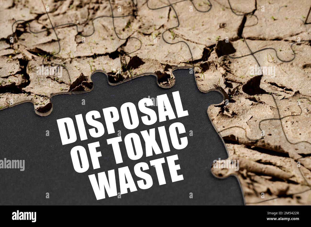 Ecological concept. The puzzles depict soil, next to a black surface ...