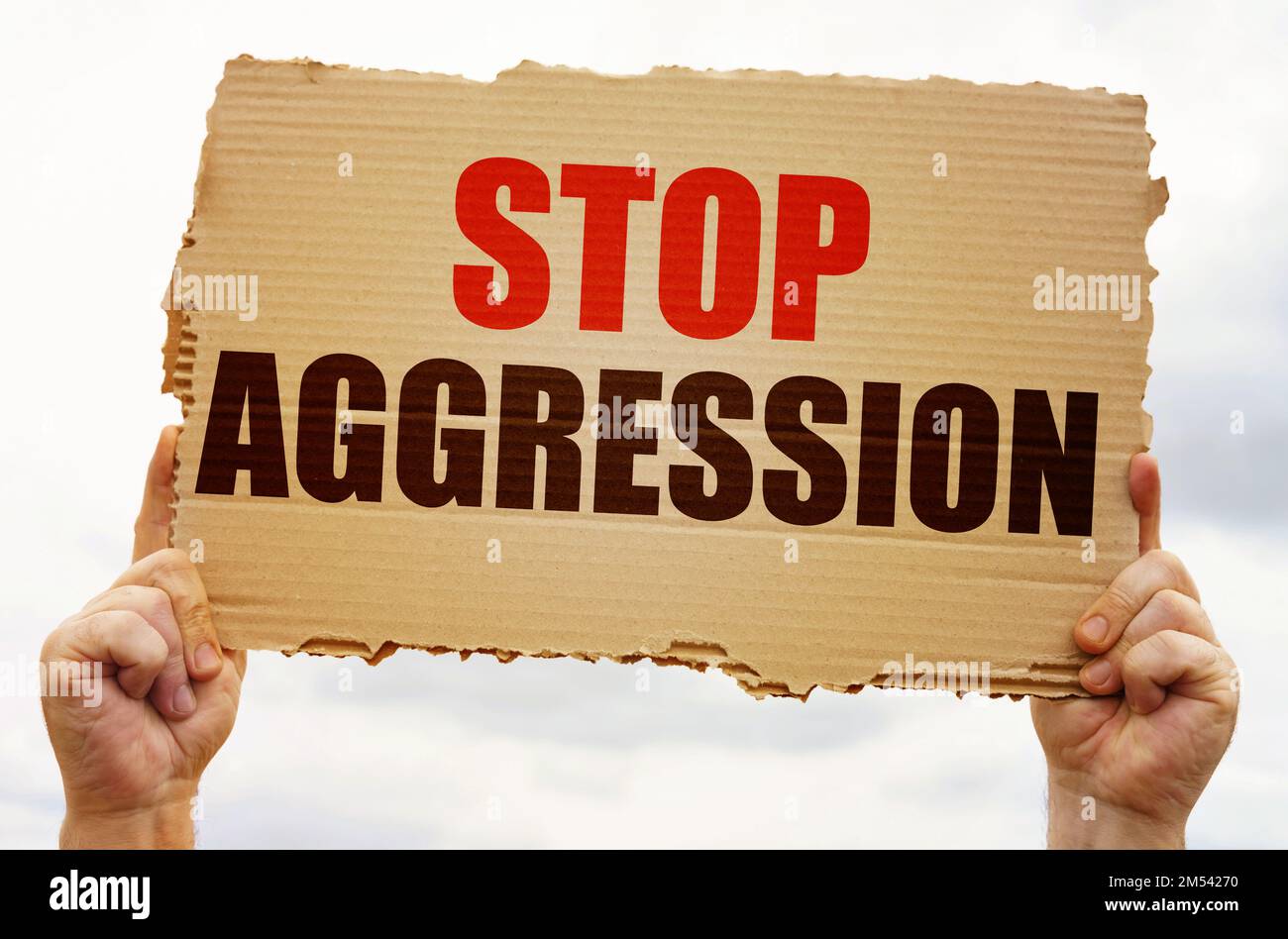 People concept. In the hands of a man is a cardboard sign with the ...