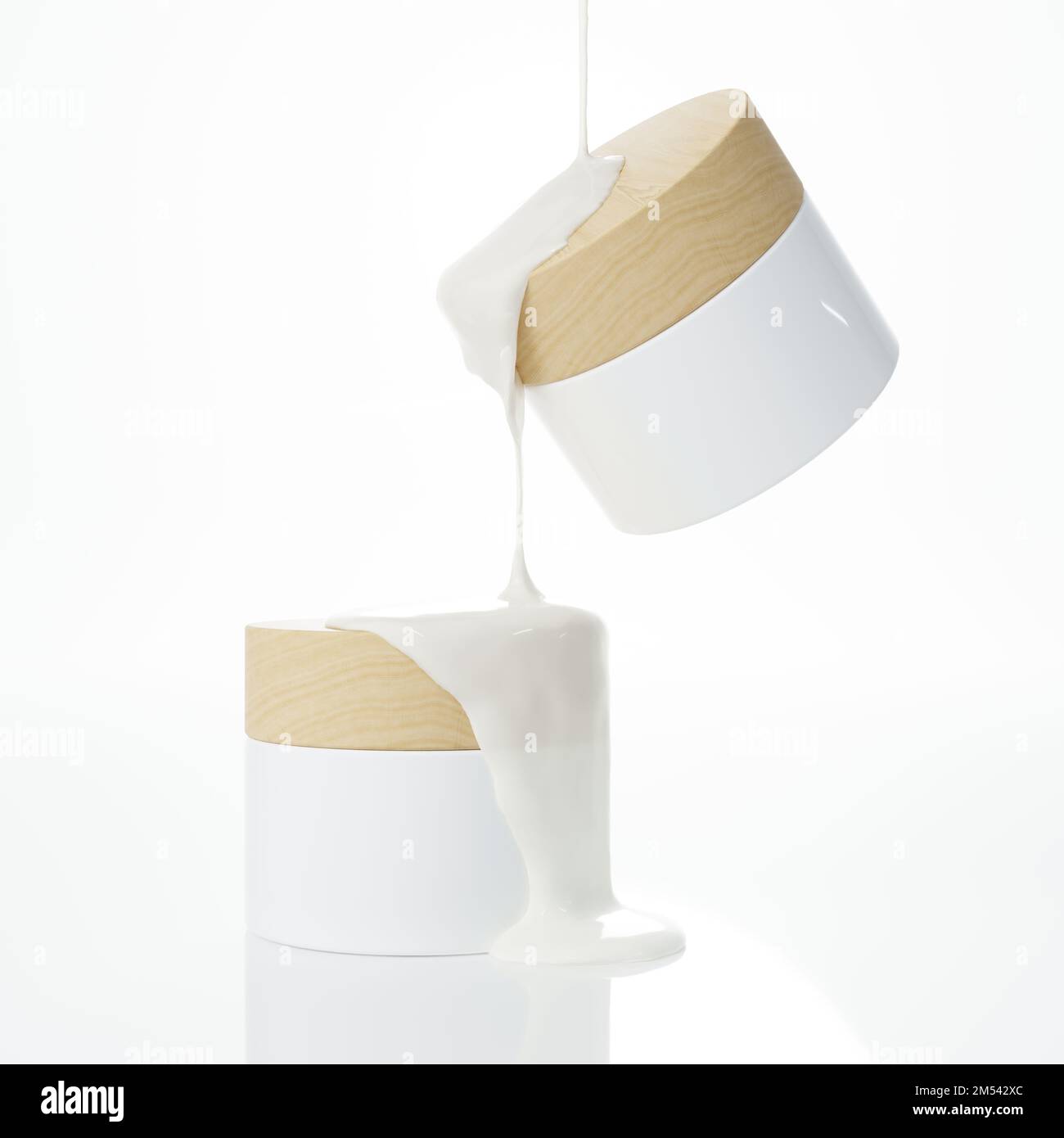 Two floating cosmetic jars with wooden lids and liquid cream flowing ...