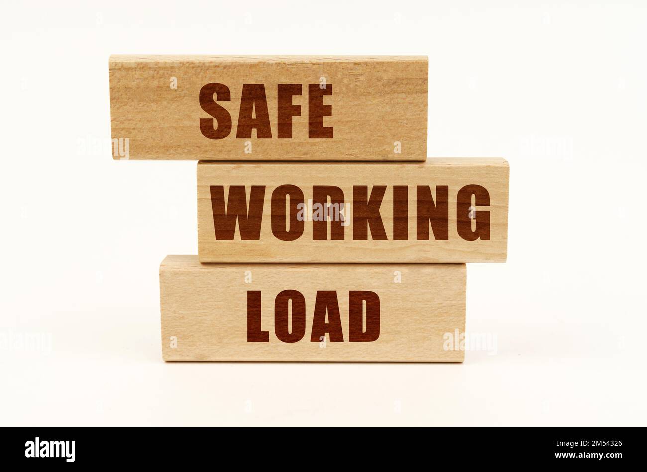 Business concept. On a white surface are wooden blocks with the ...