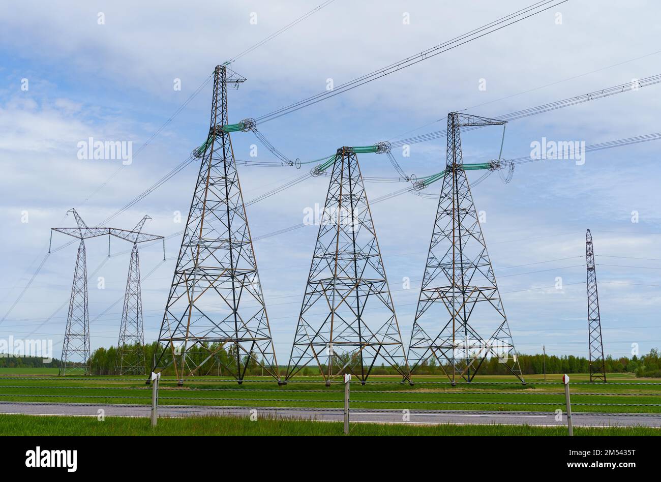 Industrial concept. Towers and high-voltage power lines in the field ...
