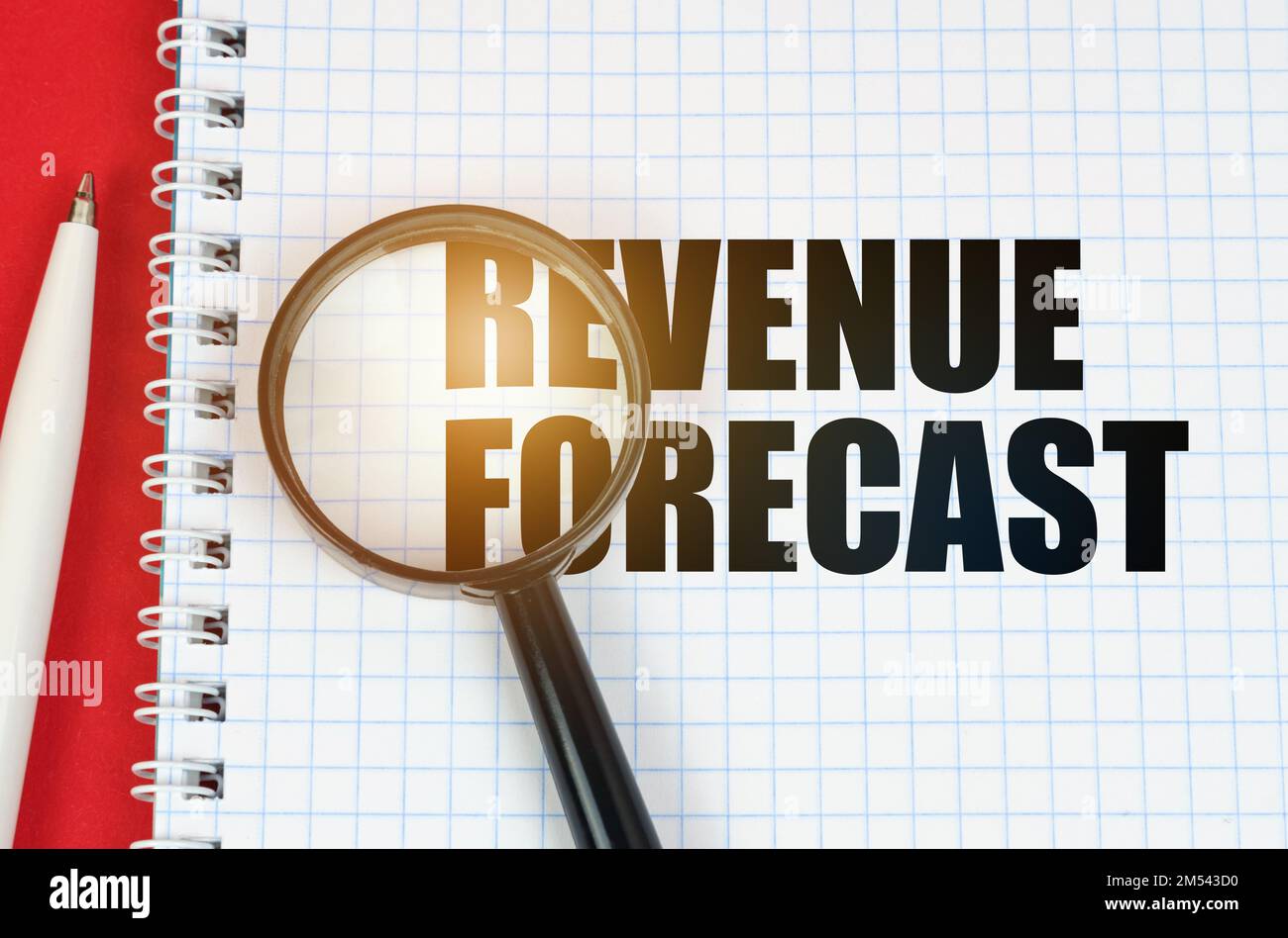 Business and finance concept. On the red surface is a pen, a notepad ...