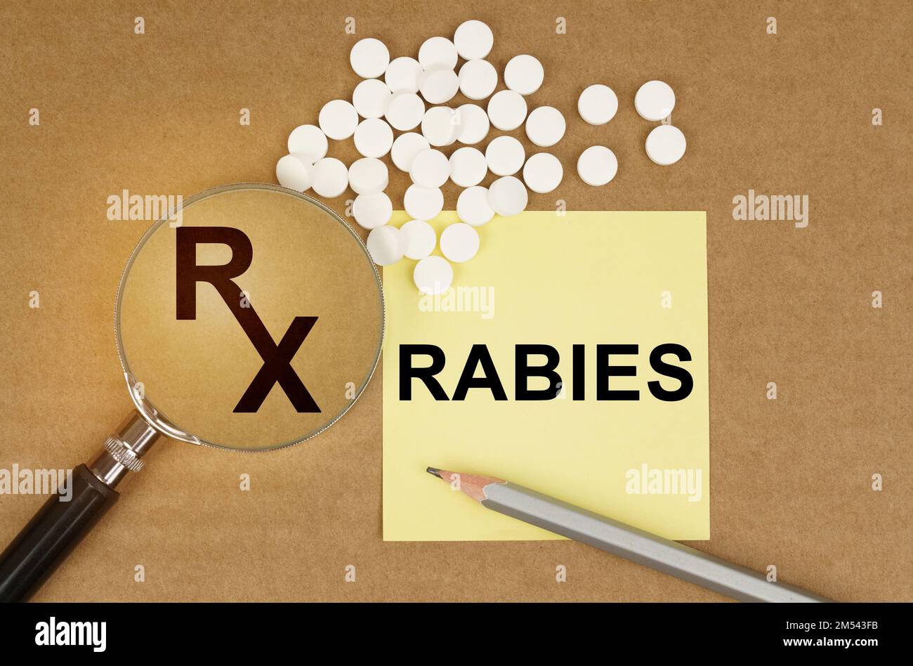 Medical concept. On the table are pills, a magnifying glass, pencils ...