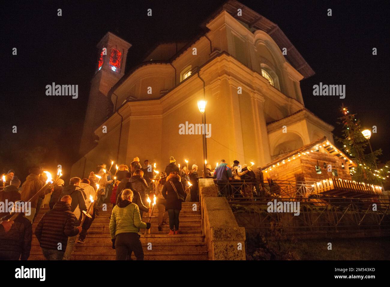 Serina Italy December 24 2022: People with torches walking towards the ...