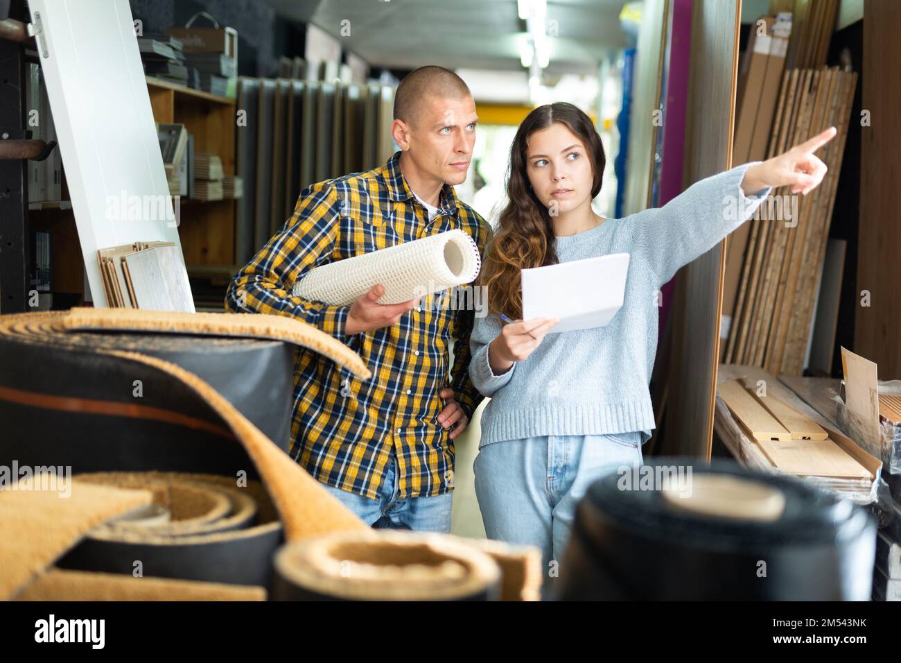 Customers shopping in building store and pointing to something Stock ...