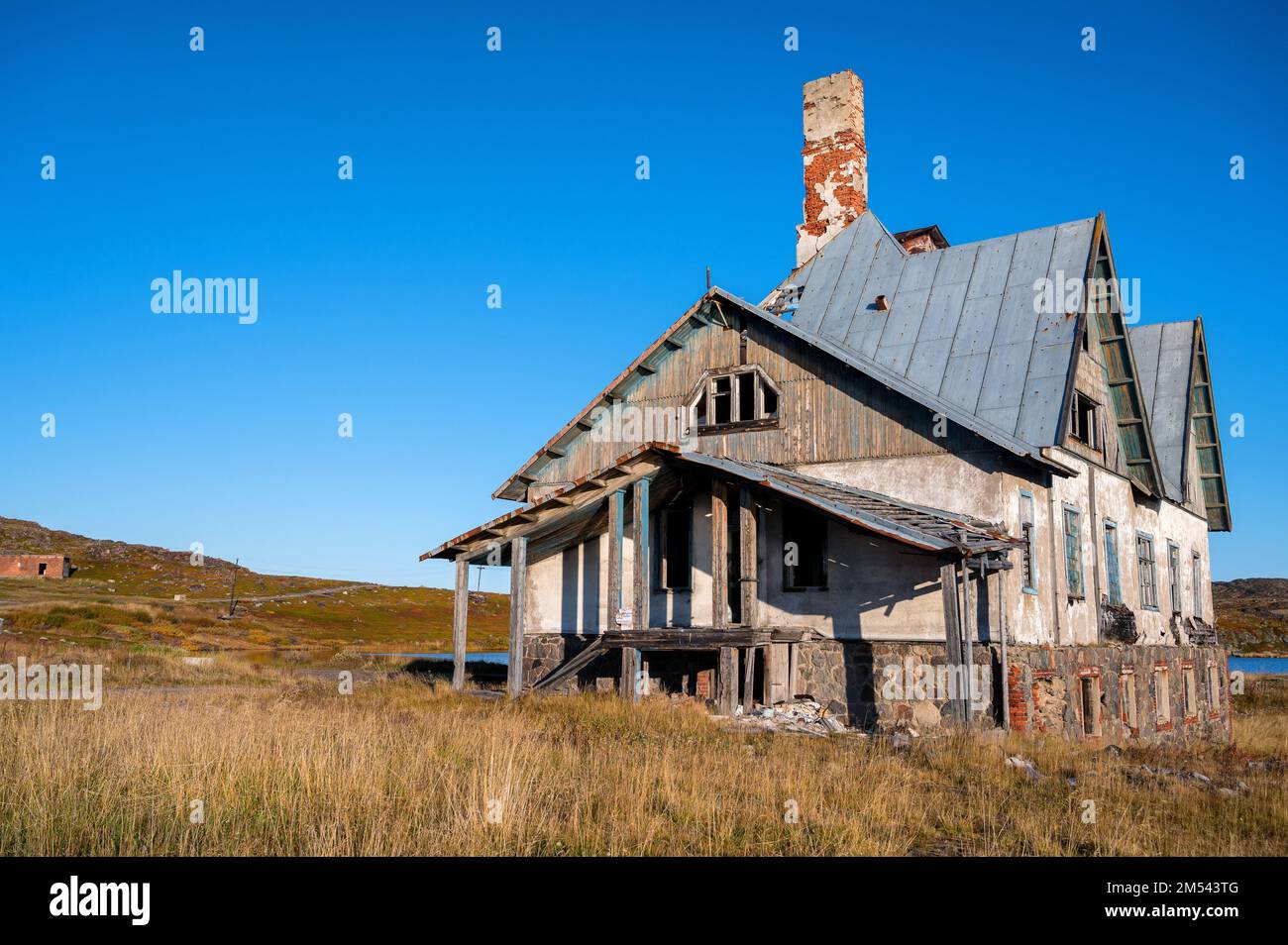 An old abandoned house in a field, close-up photo Stock Photo - Alamy