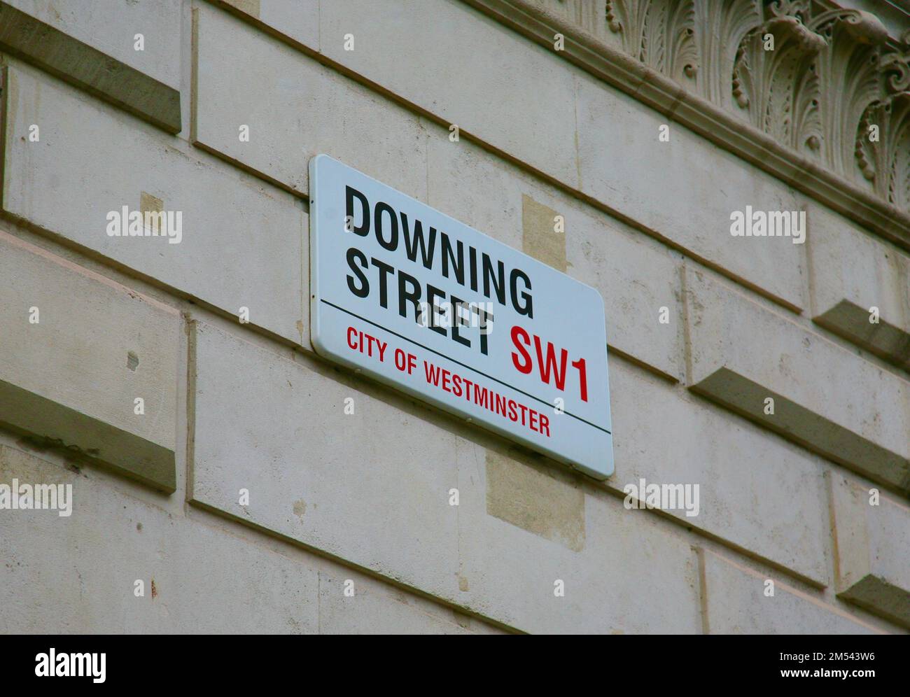 A street sign on the corner of Downing Street, City of Westminster ...